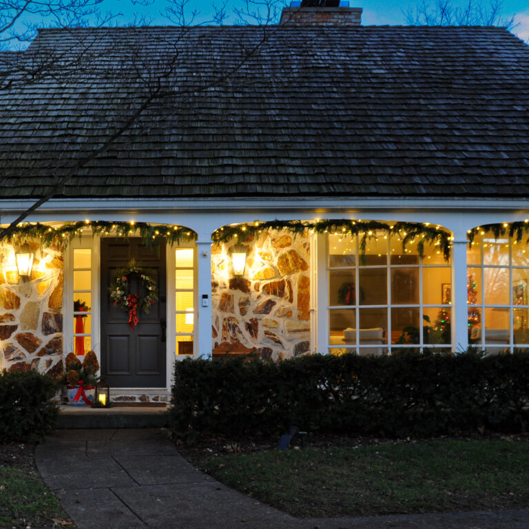 How to Hang Christmas Garland Outdoors with Lights - Building Bluebird