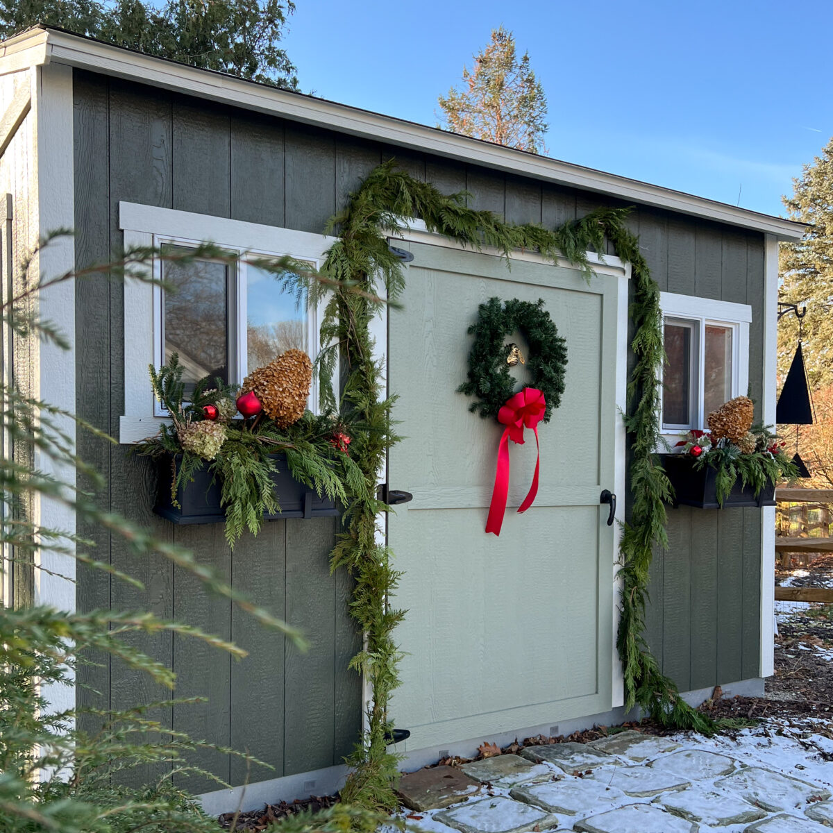 How to Hang Christmas Garland Outdoors with Lights - Building Bluebird