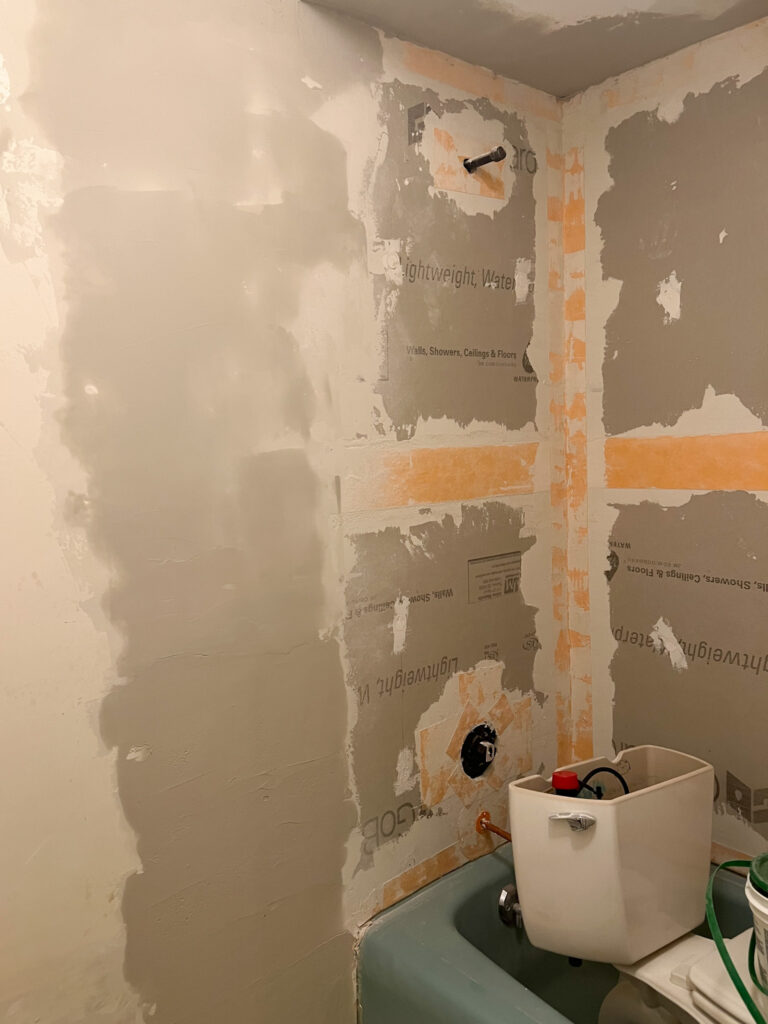 Easily Tile Your Shower Walls With This DIY Tutorial - Building Bluebird