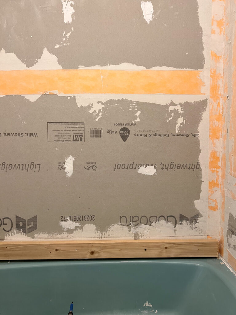 Easily Tile Your Shower Walls With This DIY Tutorial - Building Bluebird