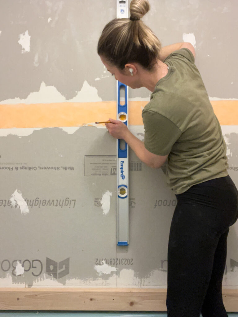 Easily Tile Your Shower Walls With This DIY Tutorial - Building Bluebird